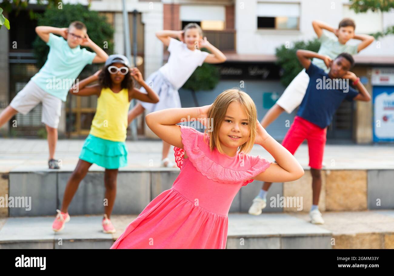 Group of kids performing street dance outdoors Stock Photo - Alamy