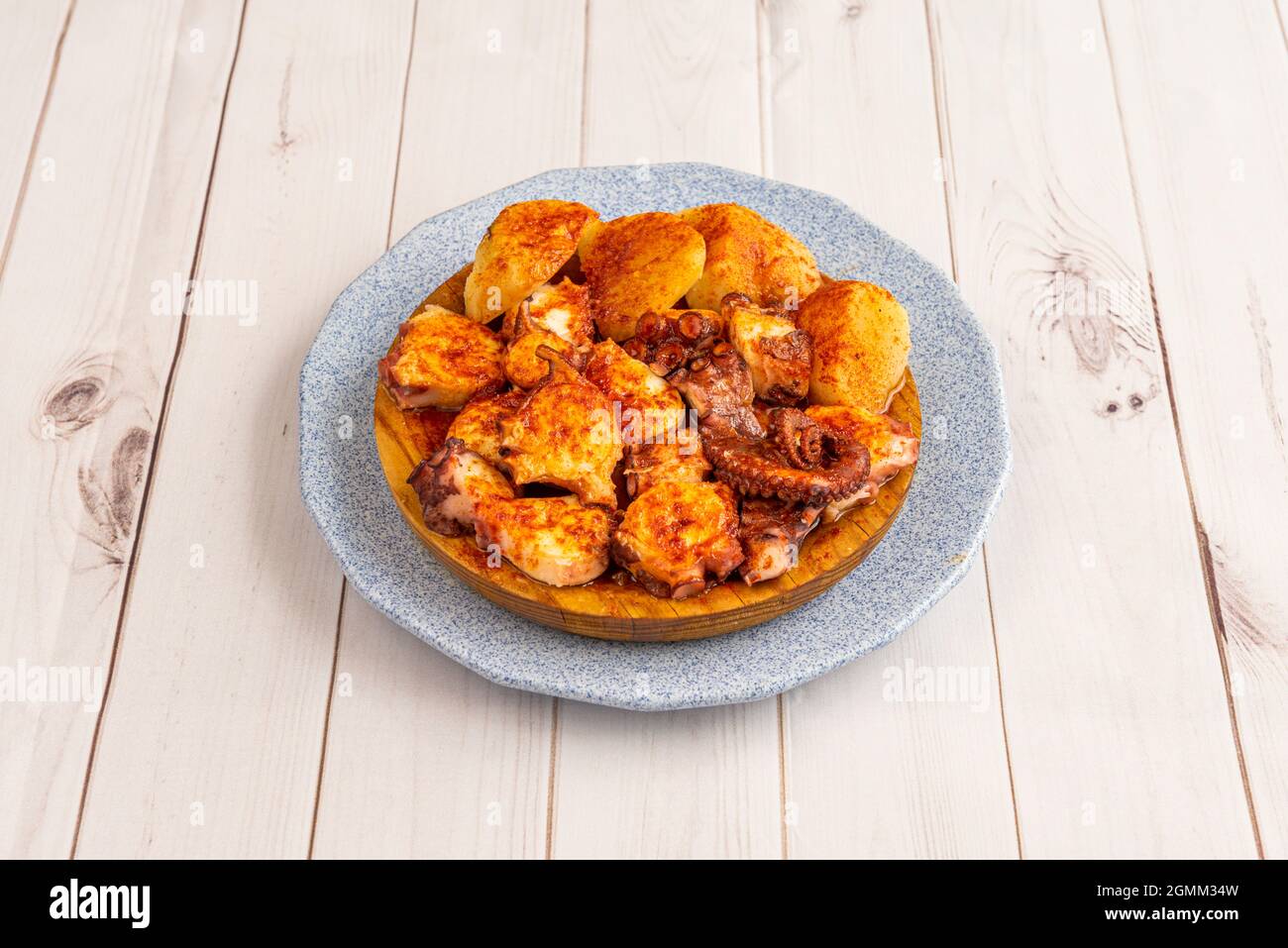 Popular Spanish tapa of Galician octopus with pepper, olive oil, coarse ...