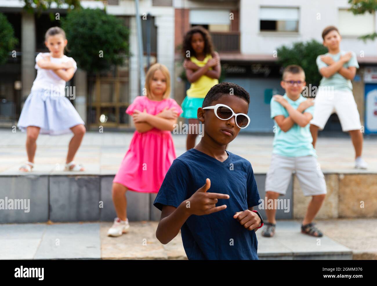 Group of kids performing street dance outdoors Stock Photo - Alamy