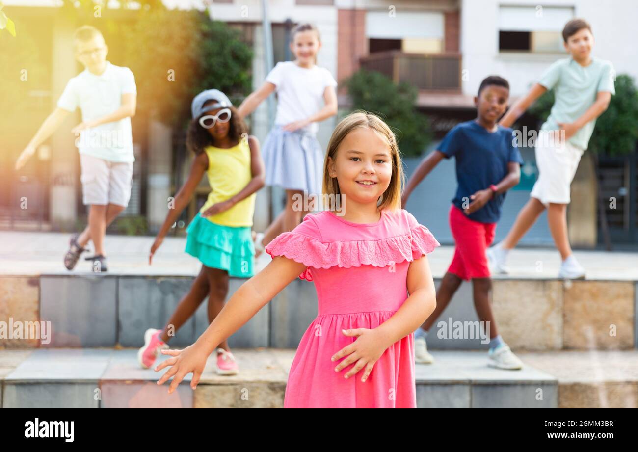 Young boys and girls dancing outdoors Stock Photo - Alamy
