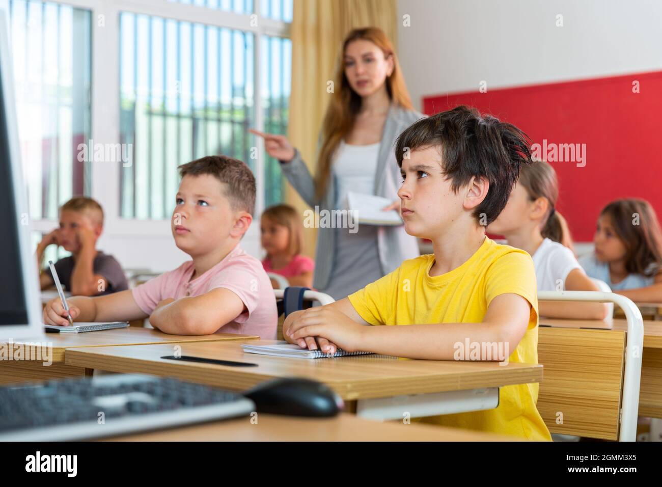 Kids studying in classroom Stock Photo - Alamy