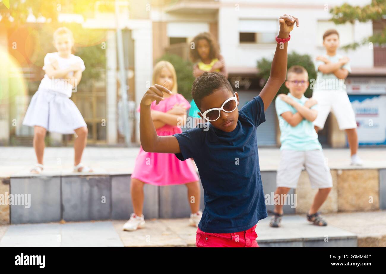 Young boys and girls dancing outdoors Stock Photo - Alamy