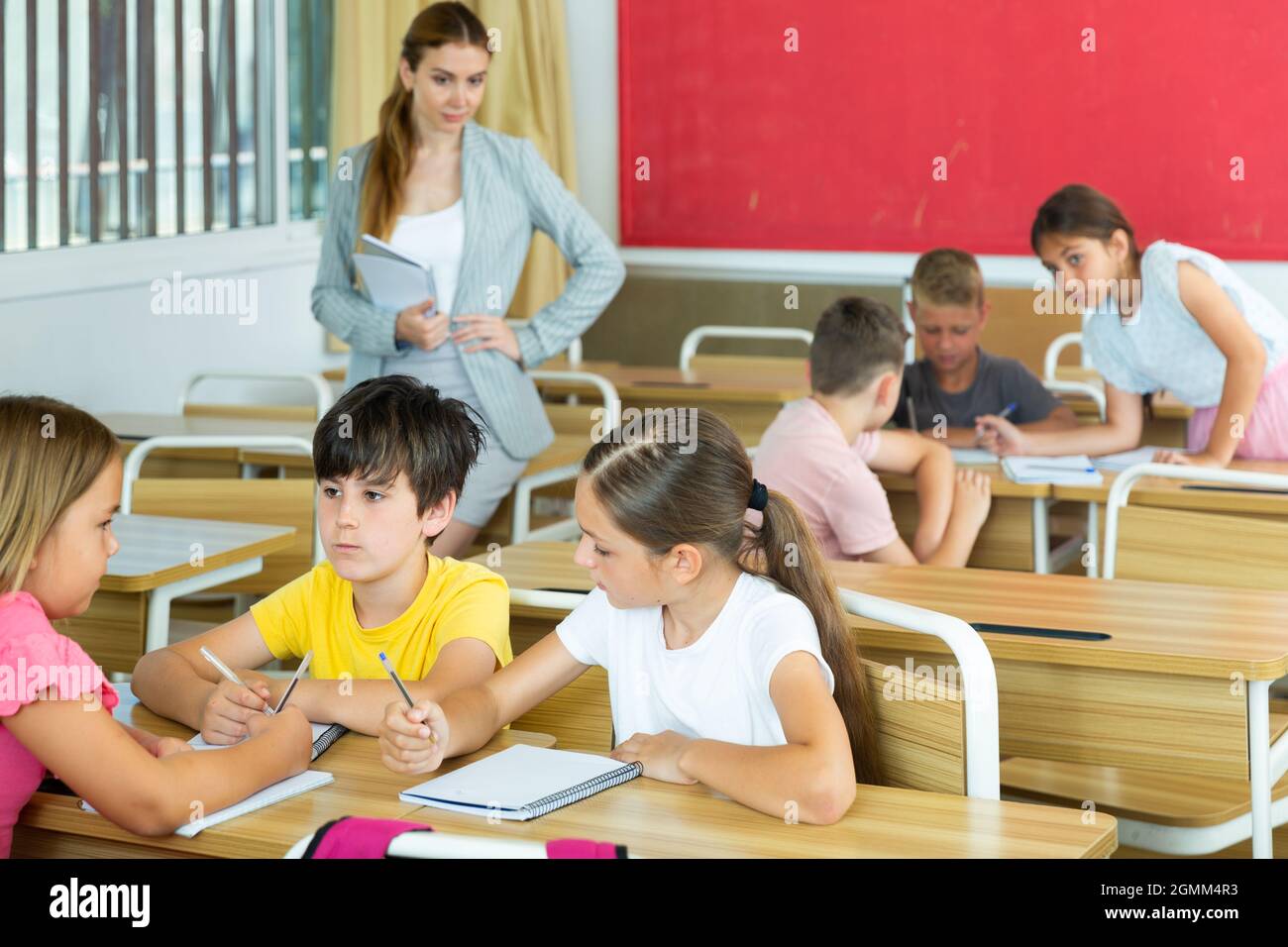 Kids doing group tasks Stock Photo - Alamy