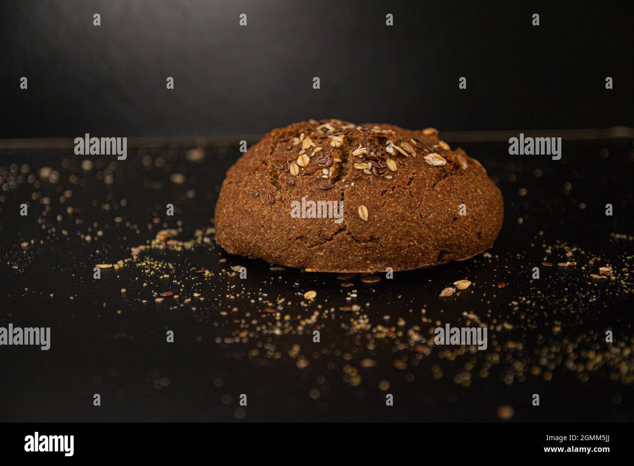 Closeup shot of sliced bun topped with nuts on a table Stock Photo - Alamy