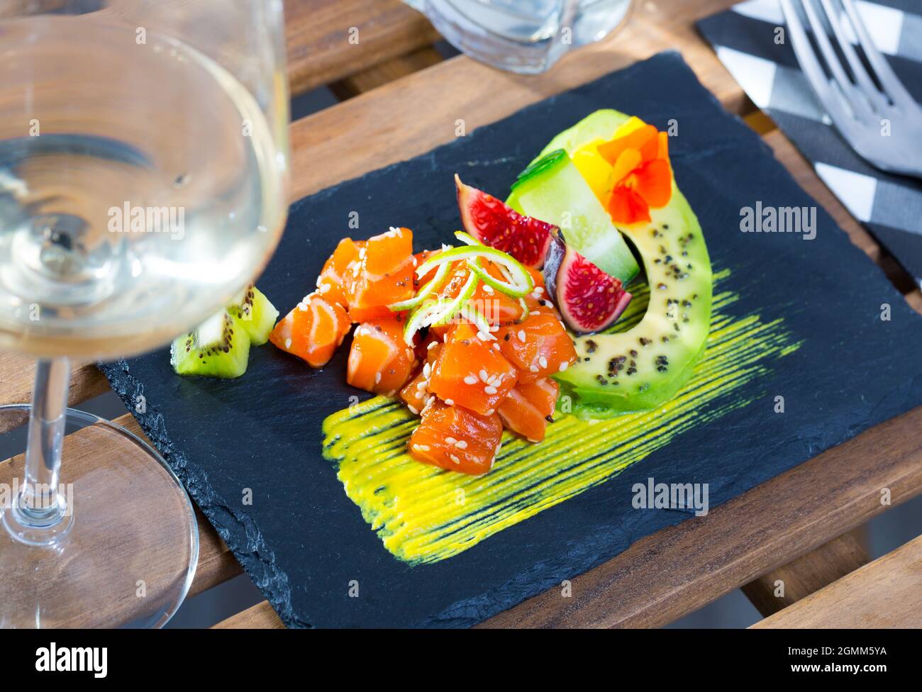 Slate of delicious tuna tartar with avocado Stock Photo - Alamy