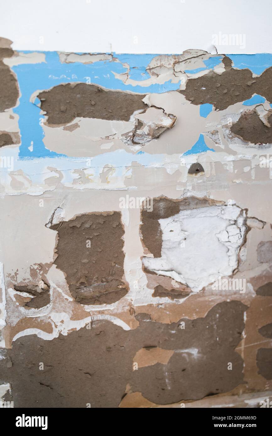 plaster walls interior exposed with old tiles and tile glue marks ...