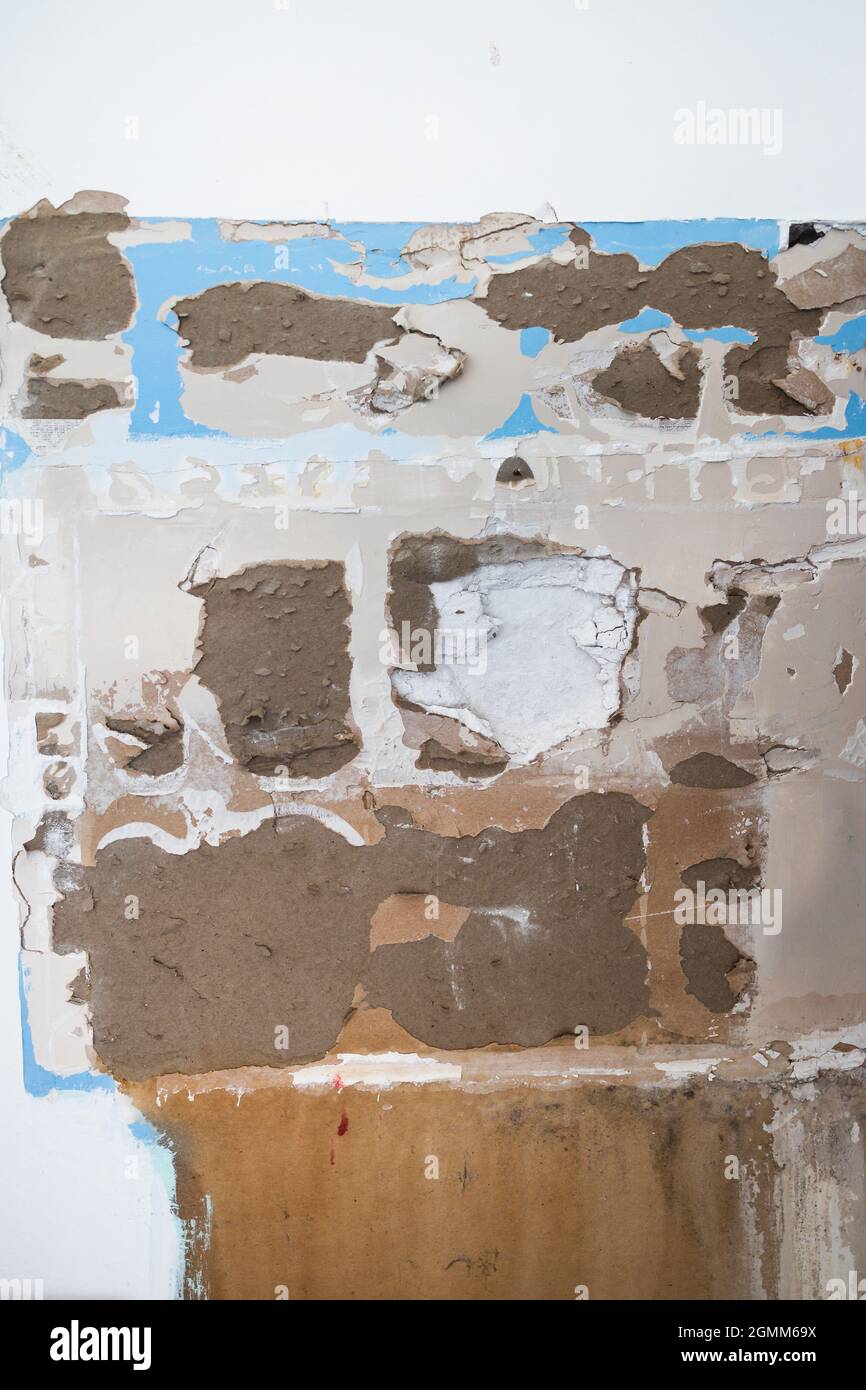 plaster walls interior exposed with old tiles and tile glue marks ...