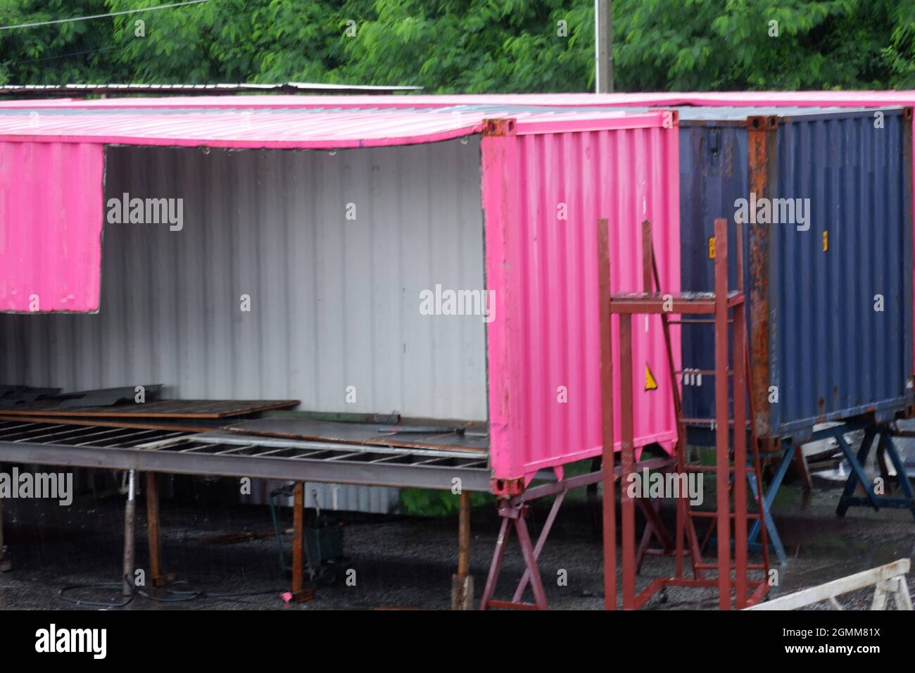 Repairing containers in container depot service Stock Photo - Alamy
