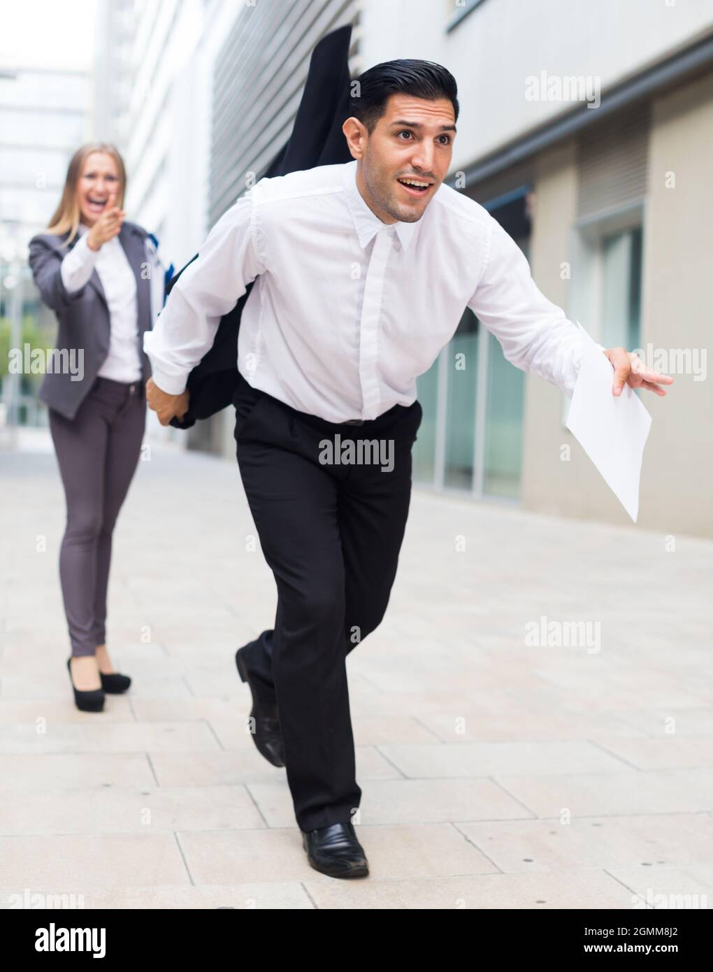 Adult employee is running away with documants from his female boss ...