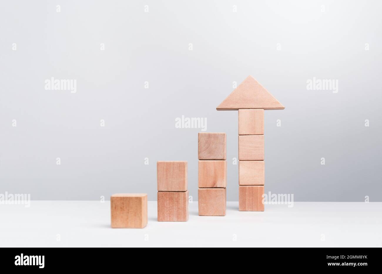 Business growth success concept. Wooden blocks stacking as an arrow up ...