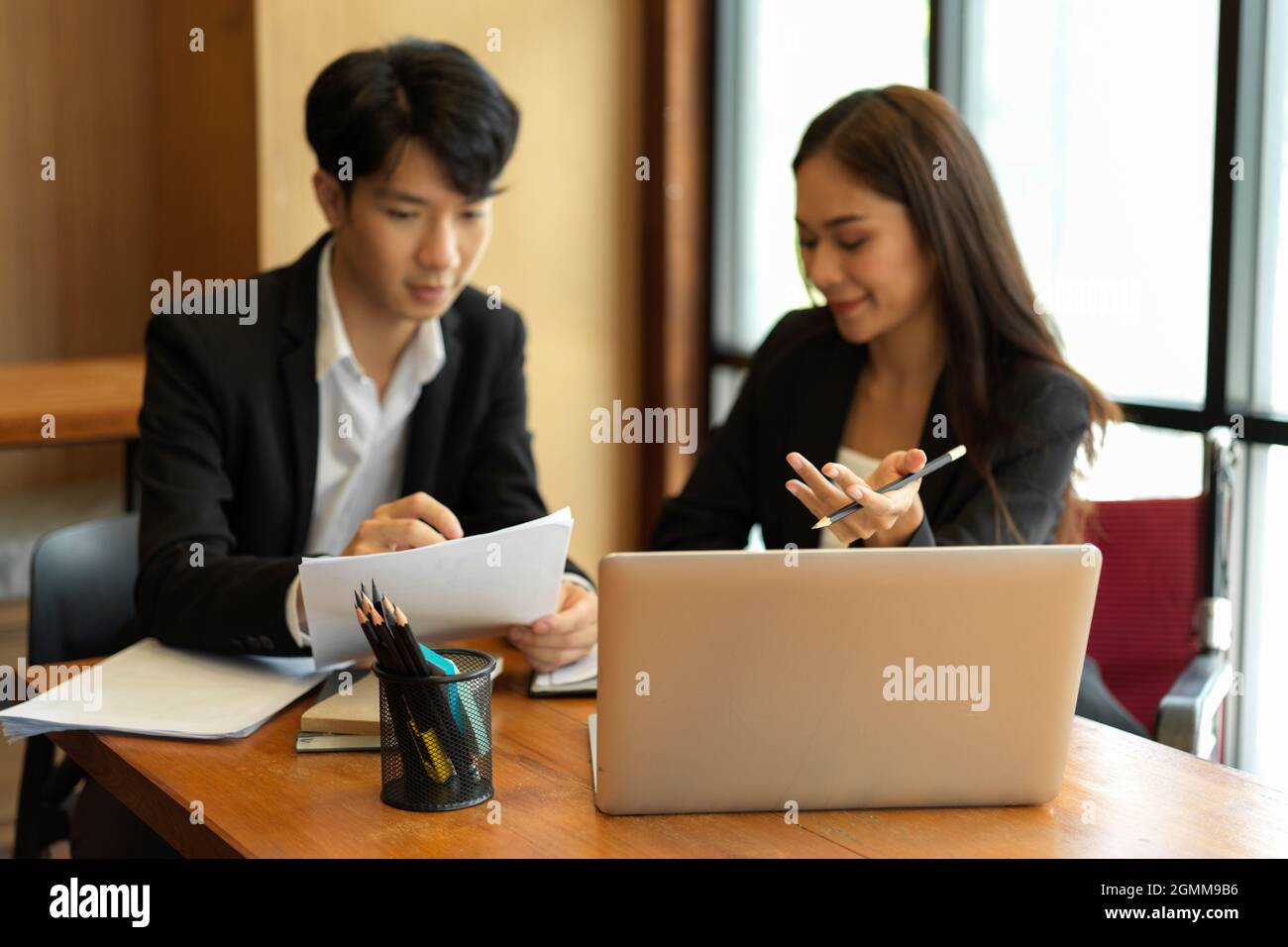 Cheerful young colleagues working together. young businesswoman in ...