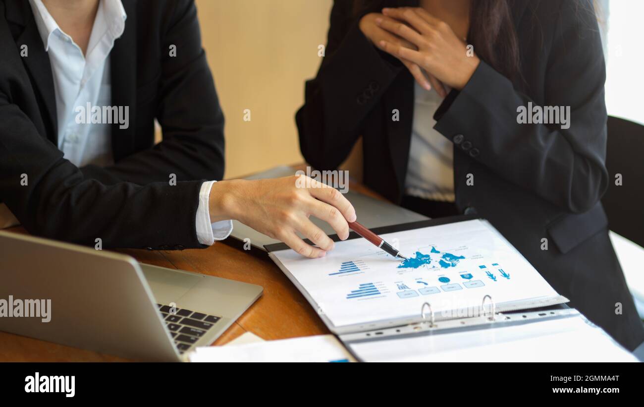 Cropped shot of financial team discuss and analyse business financial ...