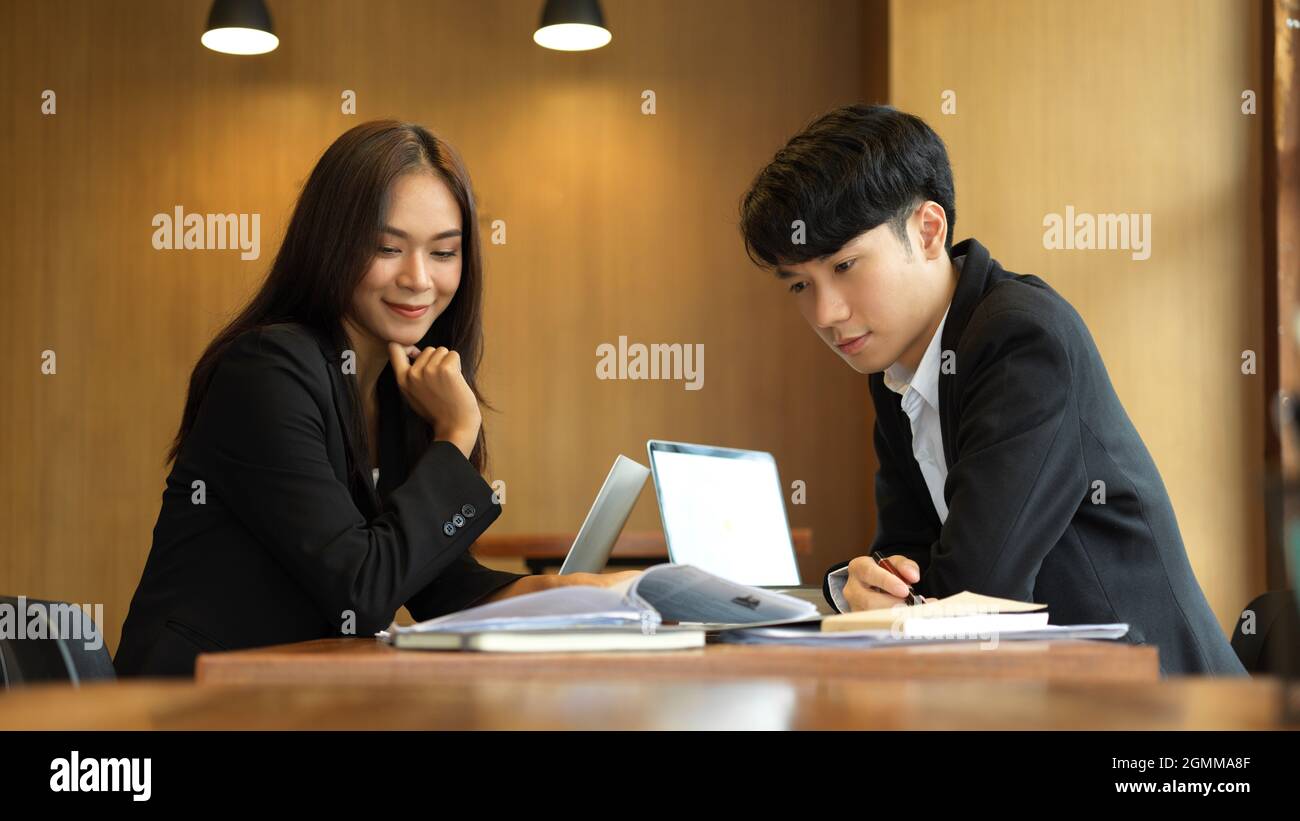 Happy business colleagues working in modern office together ...