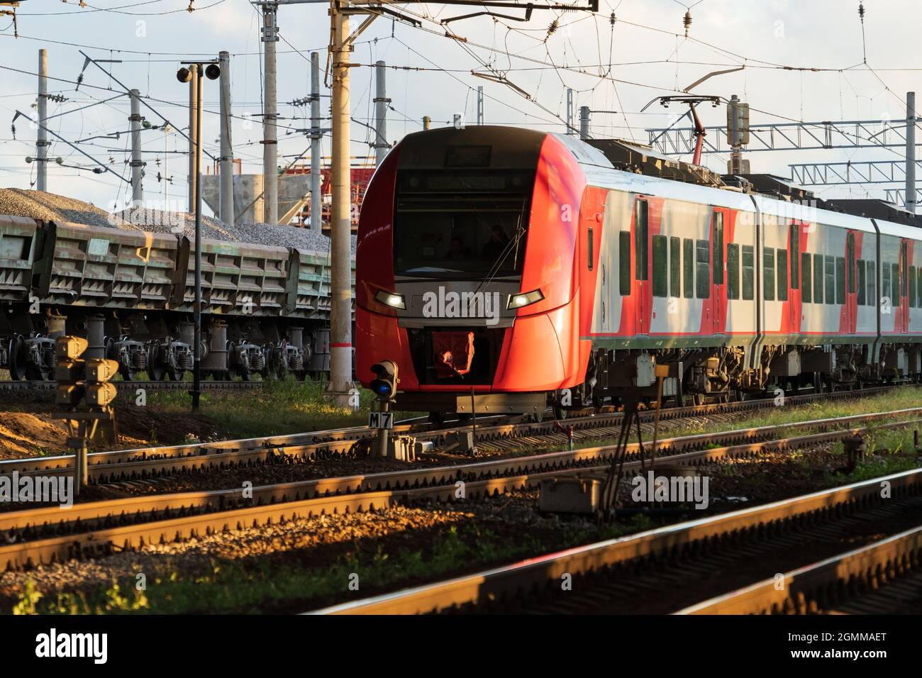 Modern intercity high speed train at sunset. Commercial suburban ...