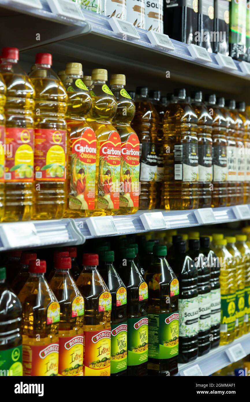 Variety of oil in grocery shop Stock Photo - Alamy