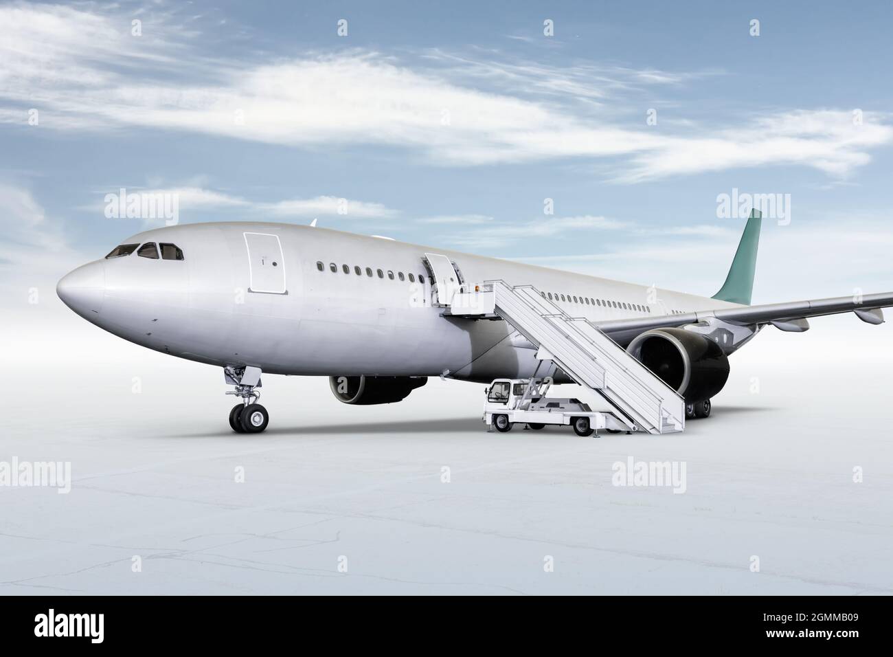 Wide body passenger airliner with a boarding stairs at the airport ...
