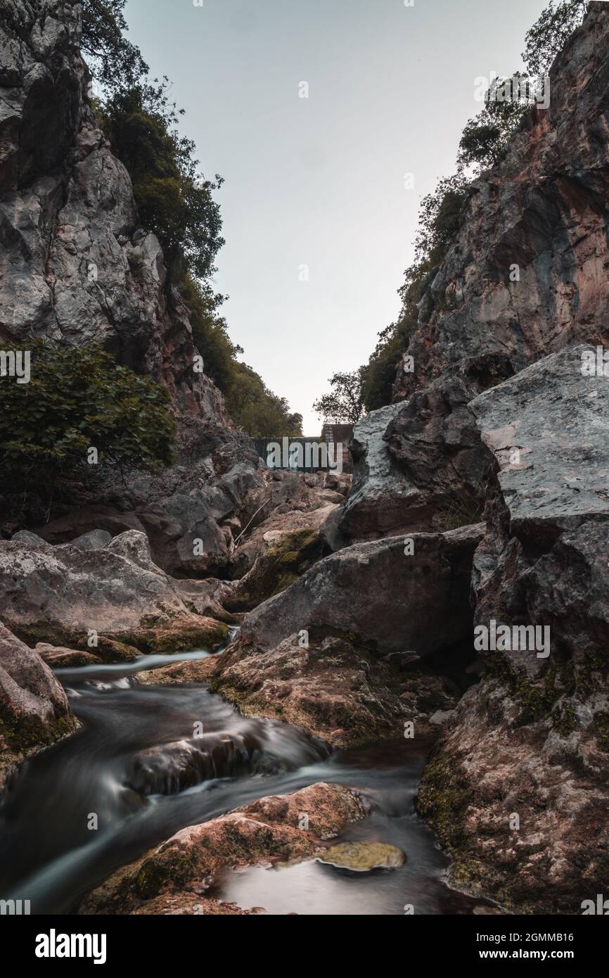 Beautiful waterfalls in between mountain gorge Stock Photo - Alamy