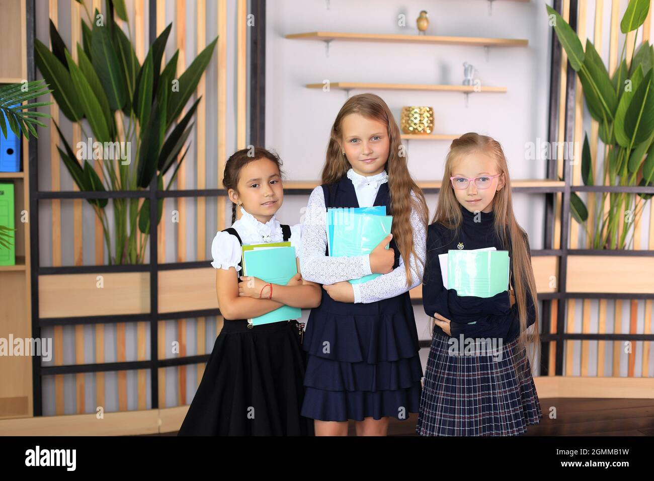 Young female students in school uniforms before the lesson in the ...