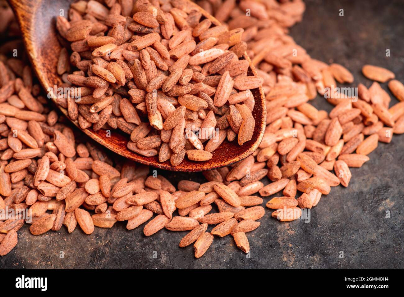 Raw red rice Dev-zira on the kitchen table. Selective focus. shallow ...