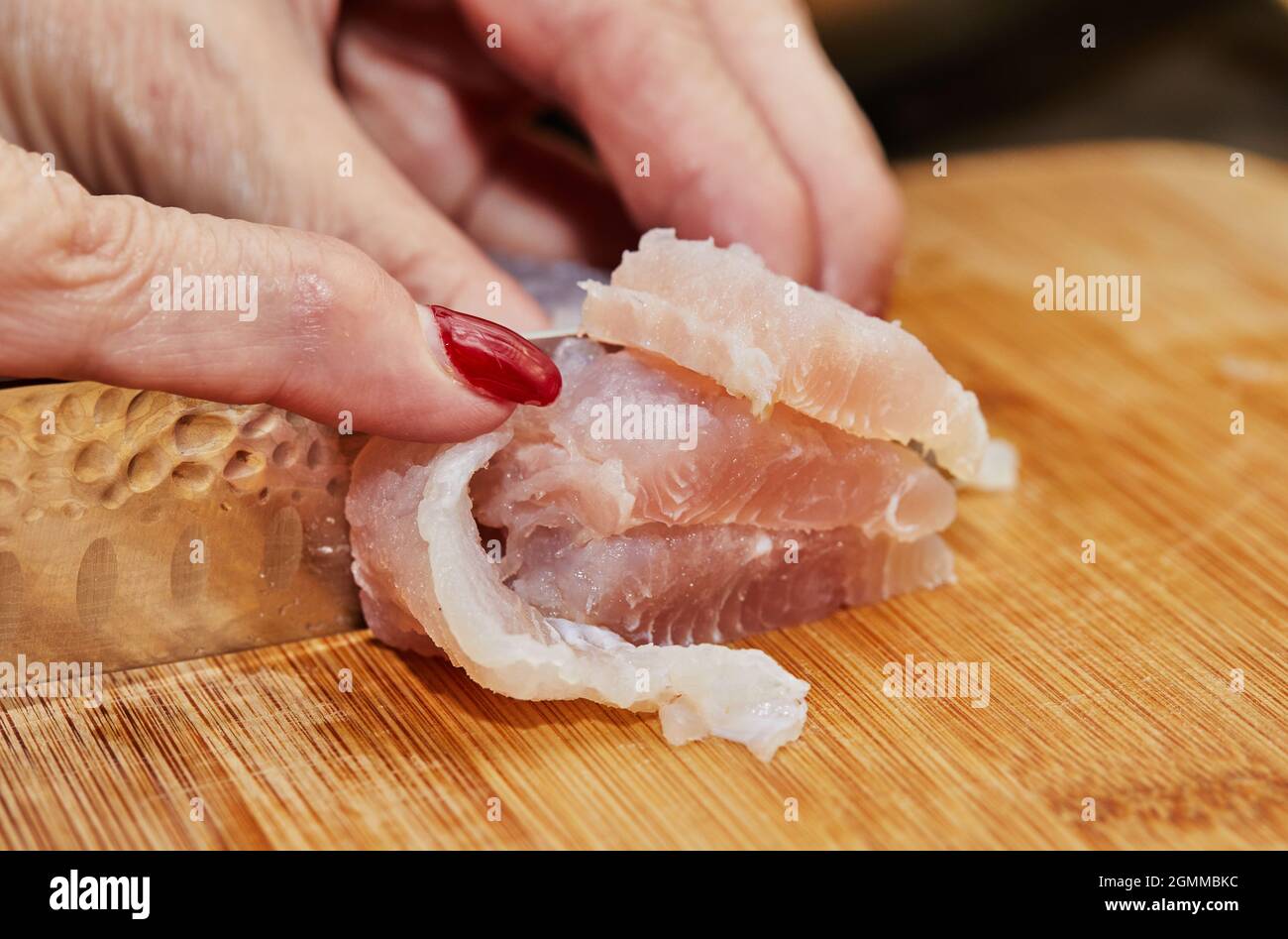 Man cutting fish fillets knife hi-res stock photography and images - Alamy