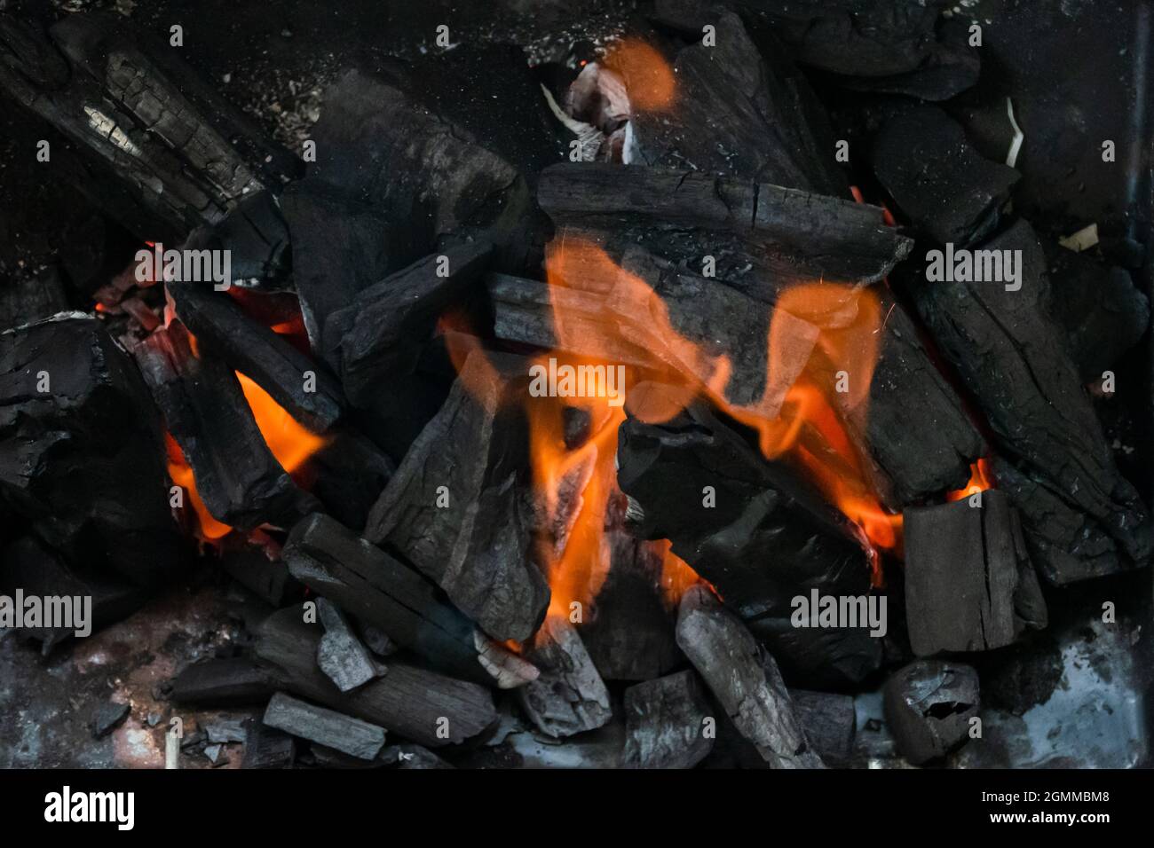 Flames in coals during barbecue, top view Stock Photo - Alamy