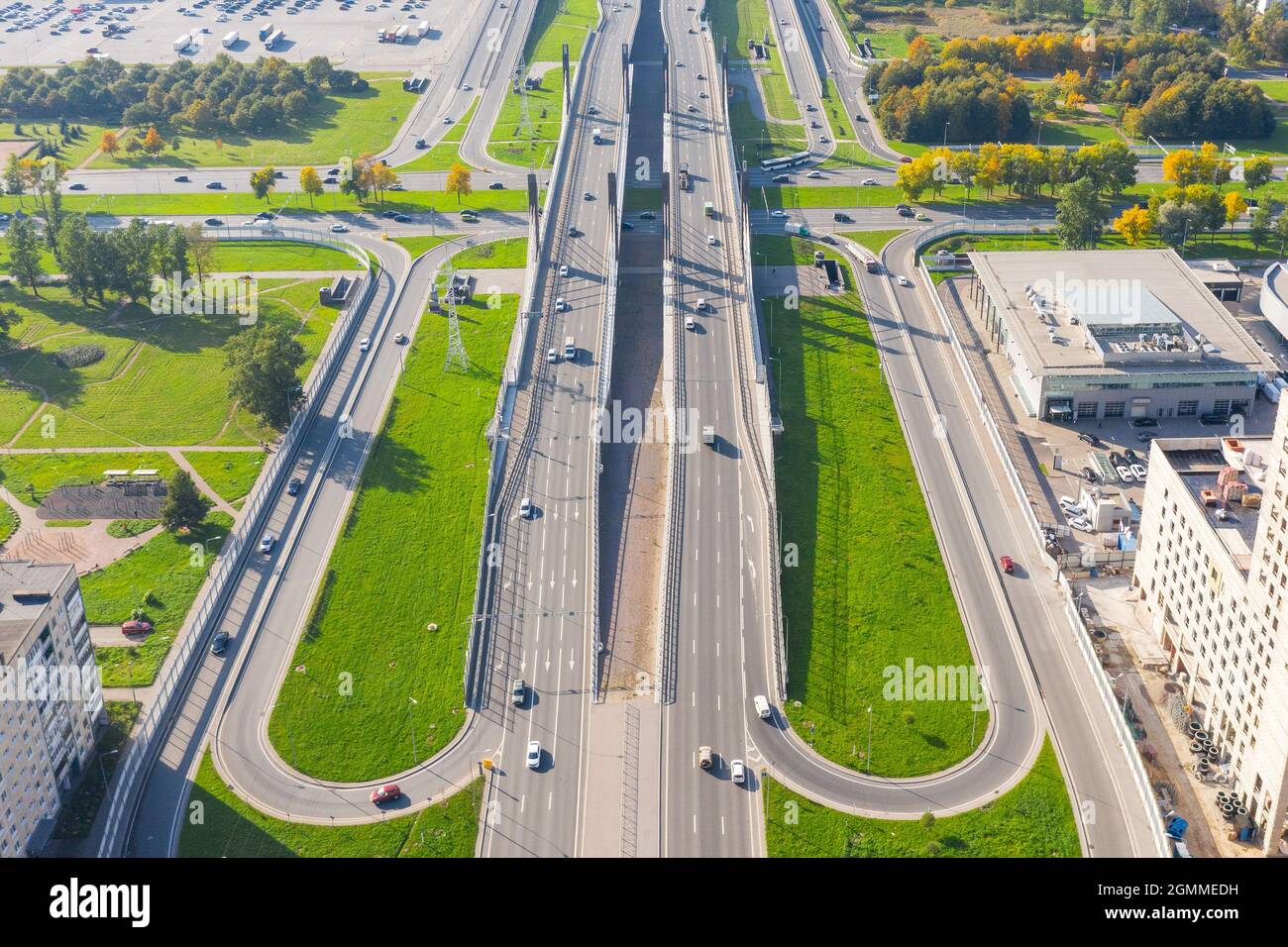 Aerial view of the intersections of the city highway. Vehicles driving ...