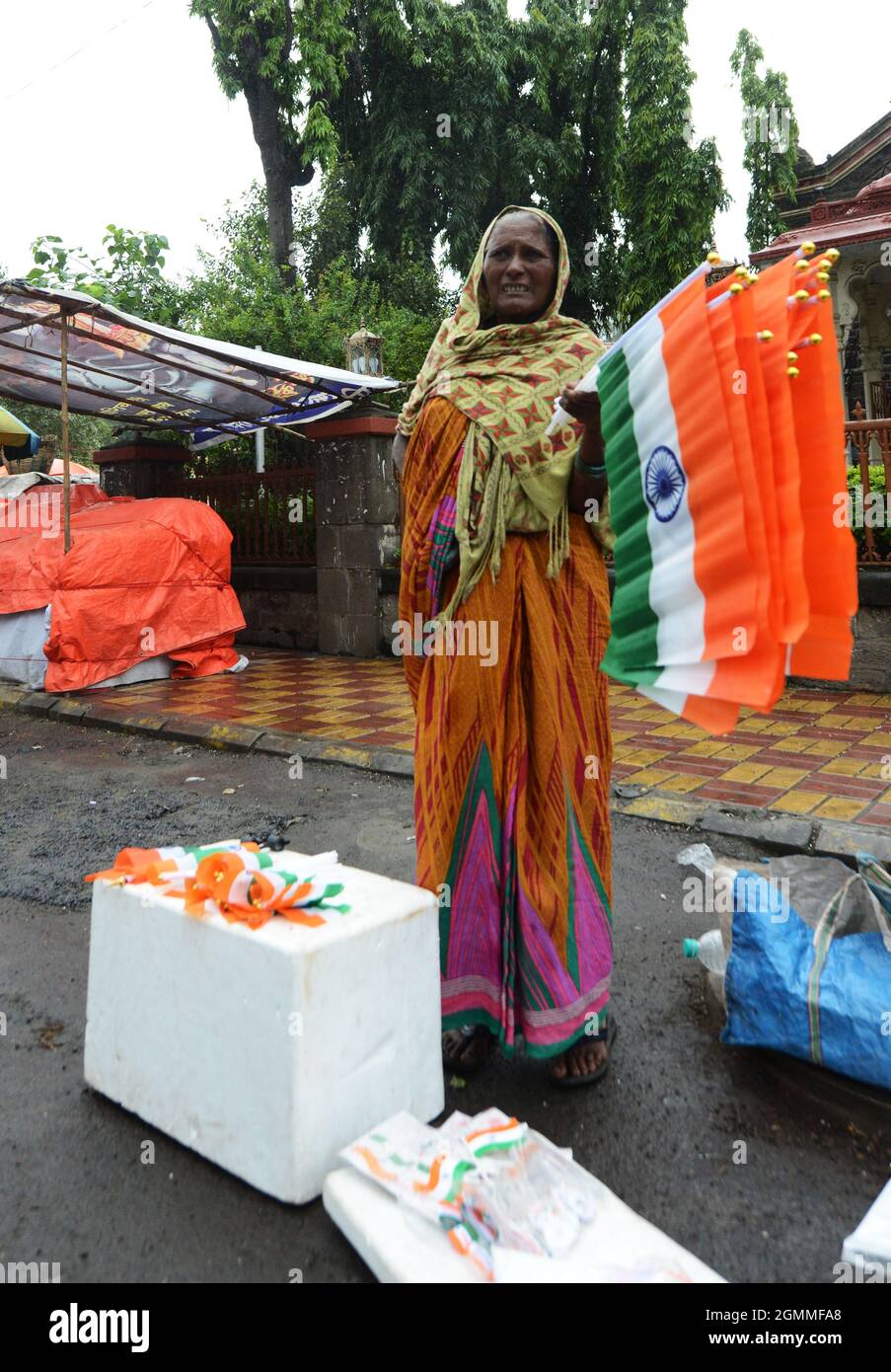 An Indian woman selling Indian flags during Independence day in Pune ...