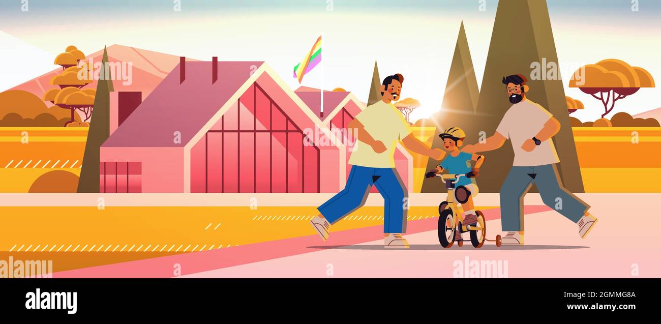 male parents teaching little son to ride bike gay family transgender ...