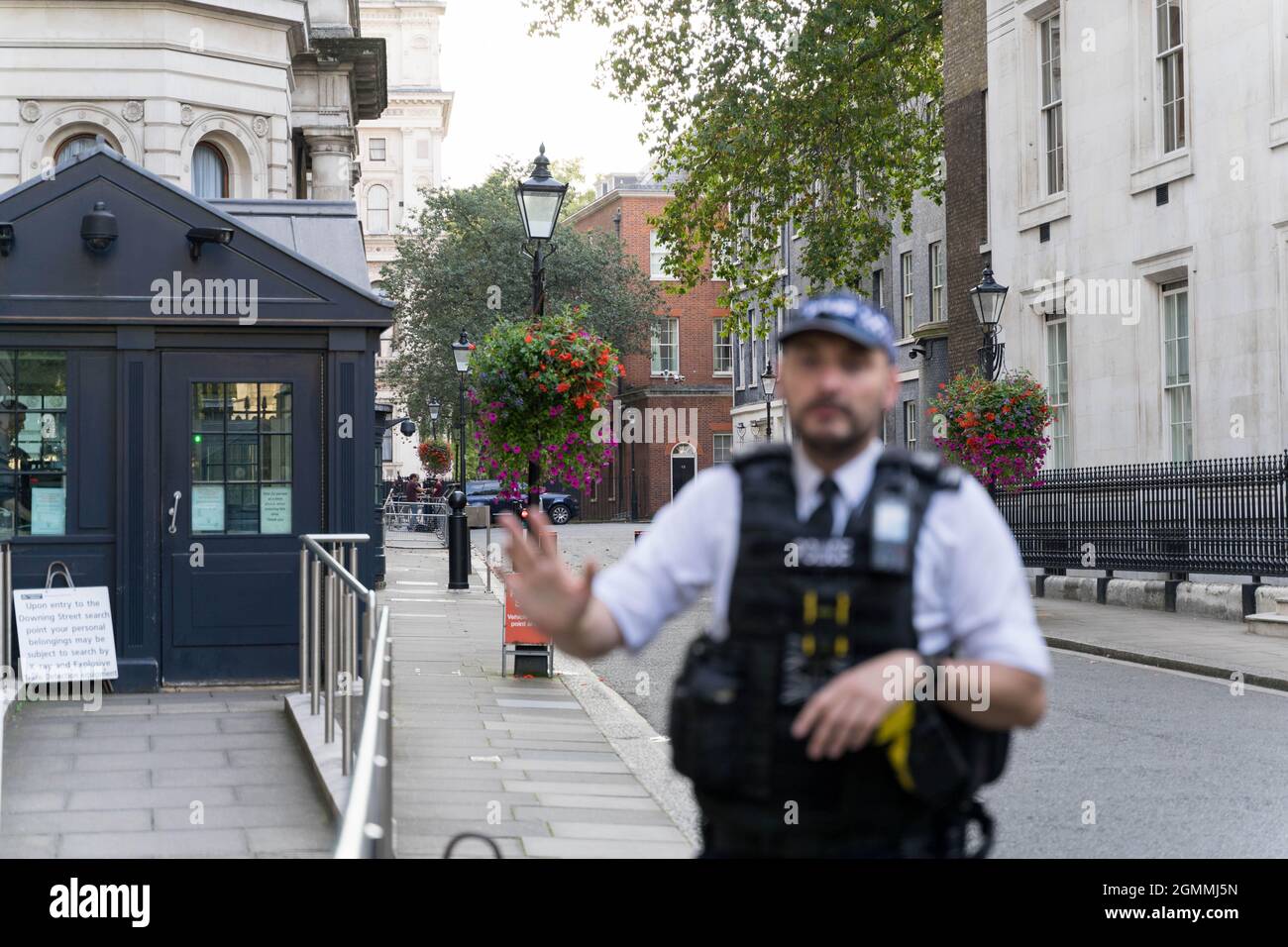 view of Downing street blocked by security guard, police London UK ...