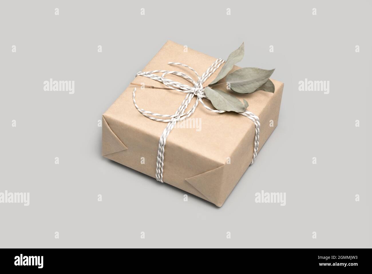 Small gift box on solid gray background Stock Photo - Alamy