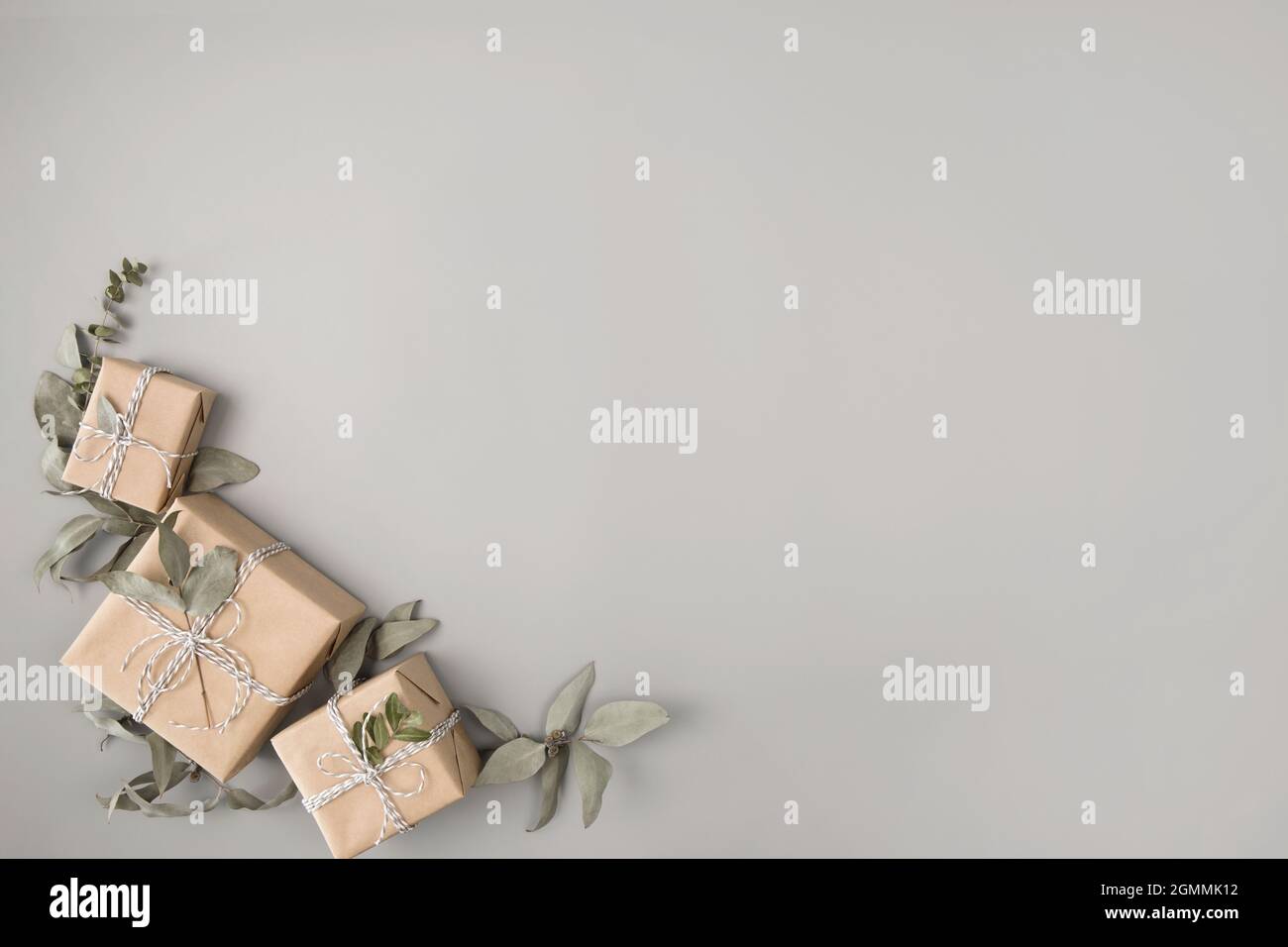 Small gift boxes on solid gray background Stock Photo - Alamy