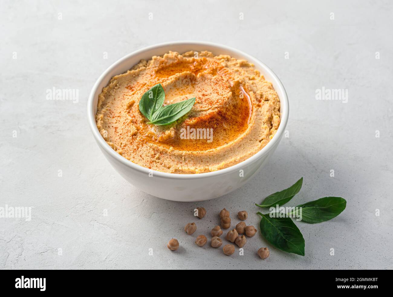 Oriental hummus with sesame, lemon and garlic on a gray background ...