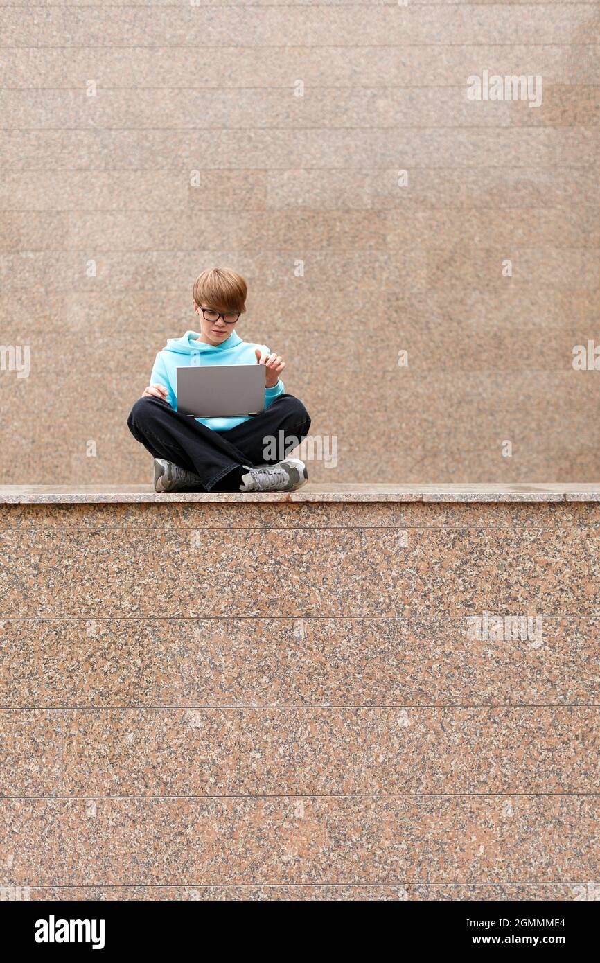 Vertical photo. Modern wireless technology concept - woman with short ...