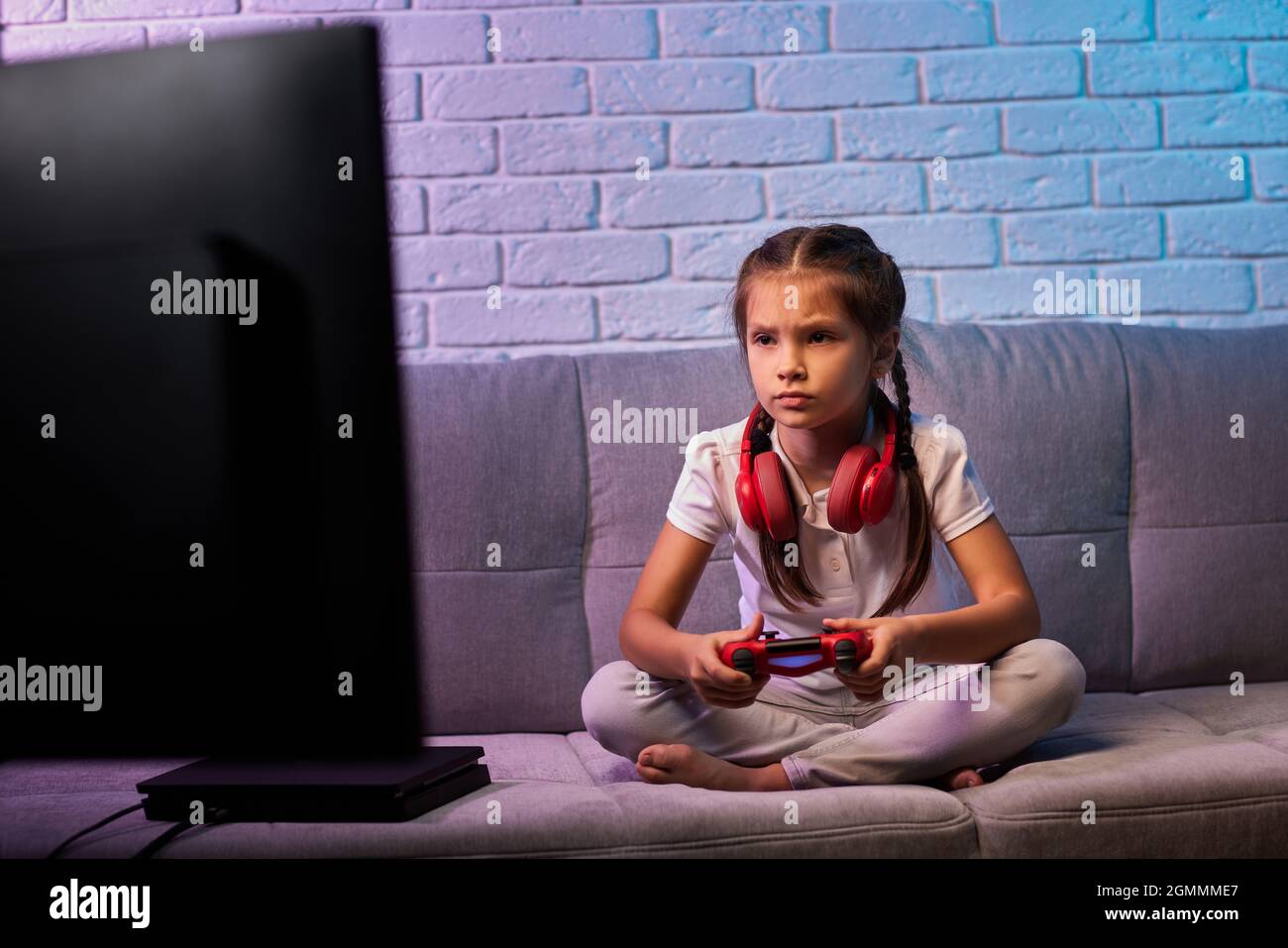 children playing video game with game console Stock Photo - Alamy