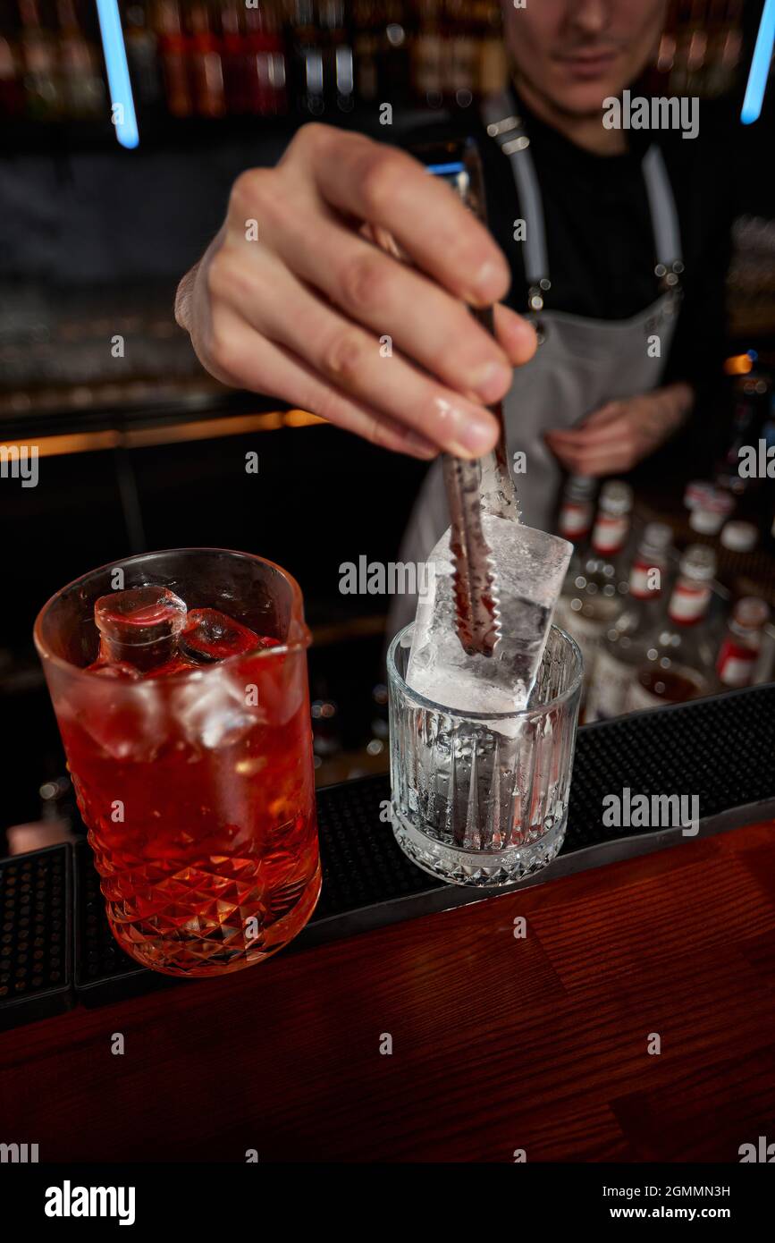Barman holds up bar hi-res stock photography and images - Alamy