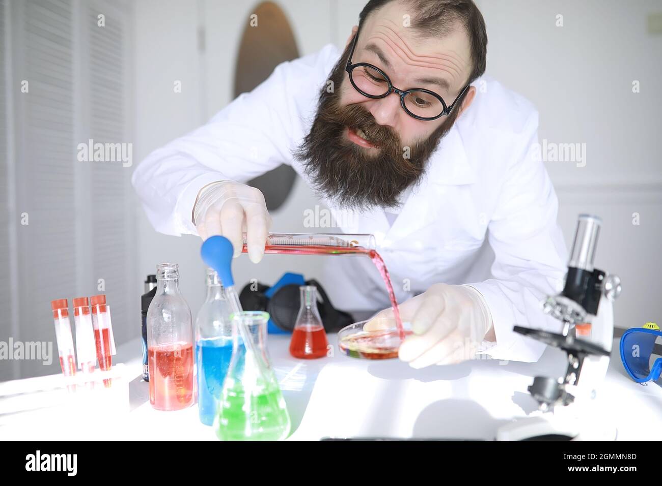 Chemist crazy. A mad scientist conducts experiments in scientific ...