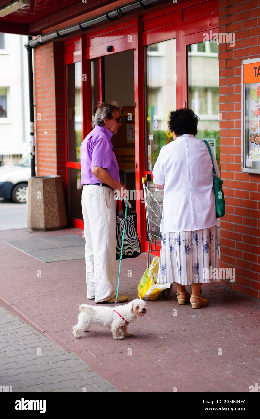 Old person walking dog man woman hi-res stock photography and images ...