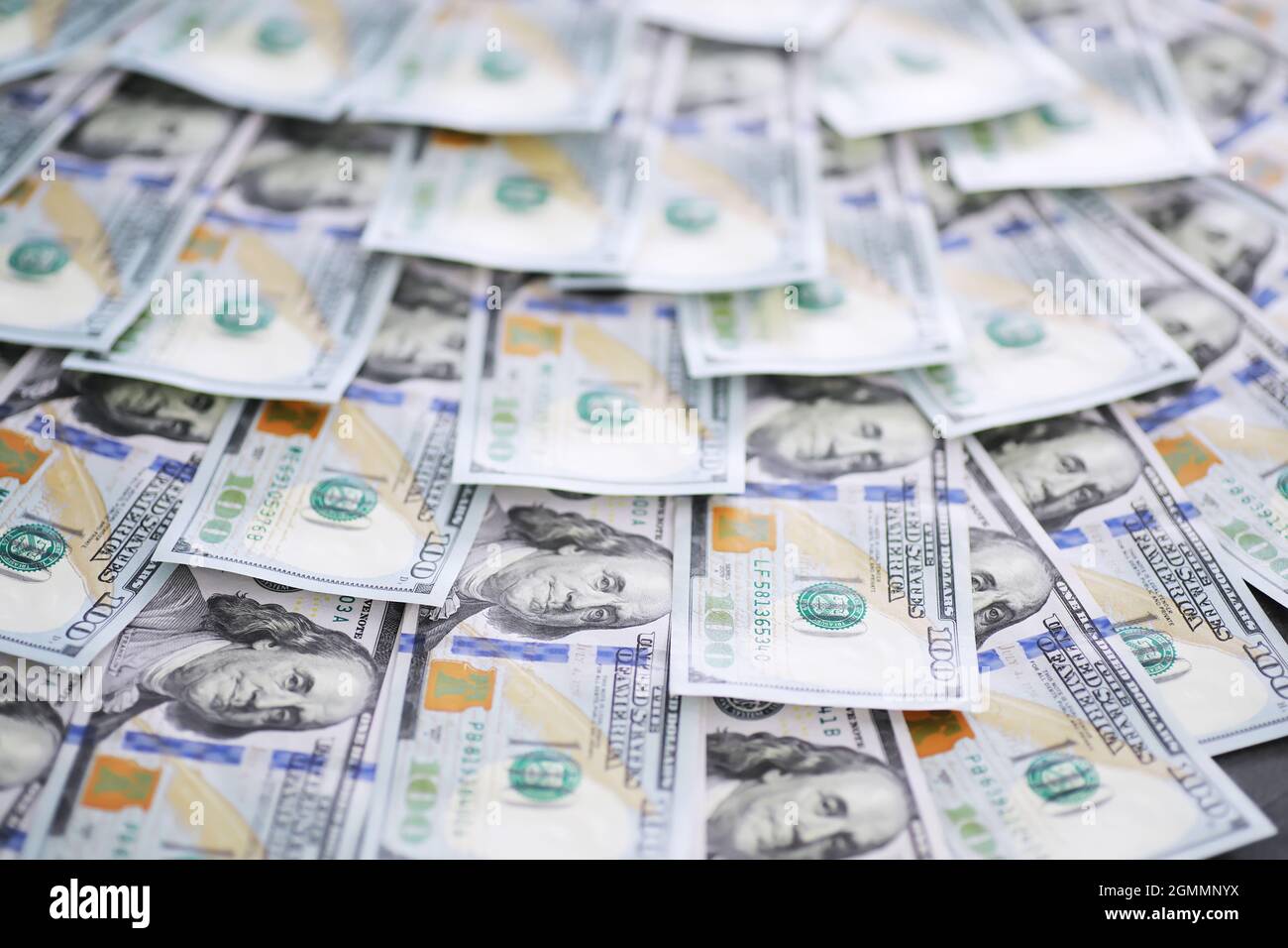 Cash money in a large pile as a finance background. Paper money close ...