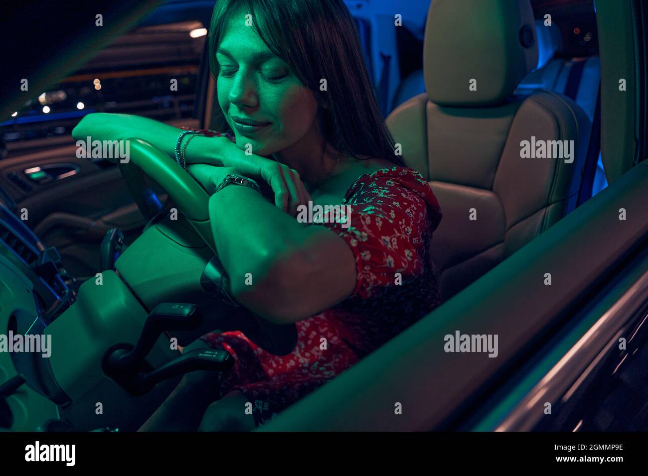 Travel woman sleeping in car at night Stock Photo - Alamy