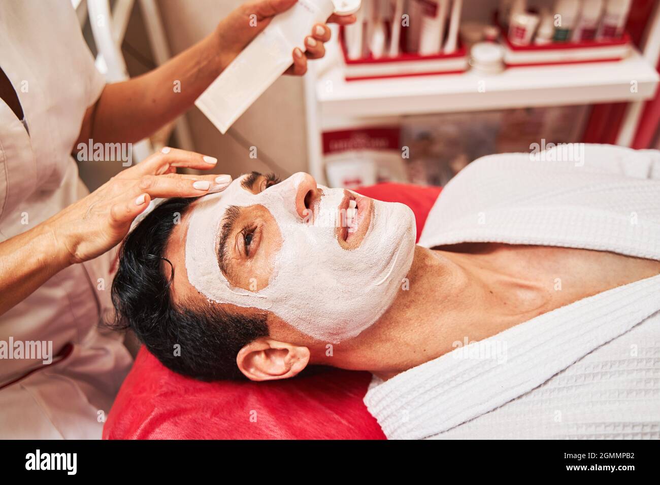 Male cosmetologist putting mask hi-res stock photography and images - Alamy