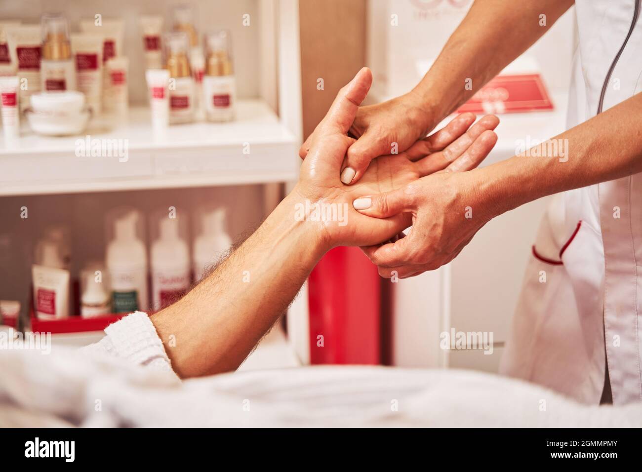 Hand massage in spa parlor performed by beautician Stock Photo - Alamy