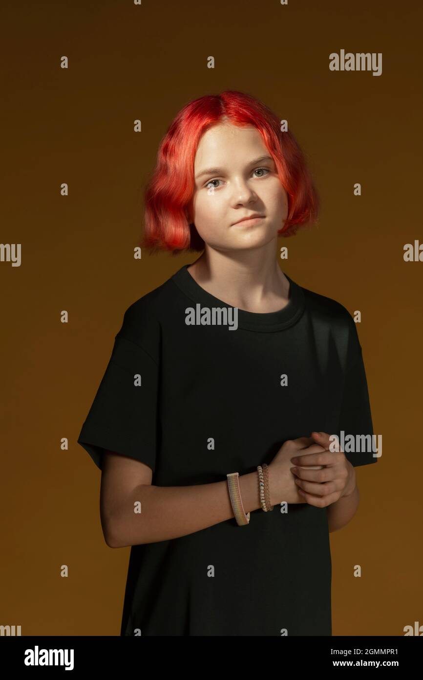 Portrait confident teenage girl with short red hair Stock Photo - Alamy