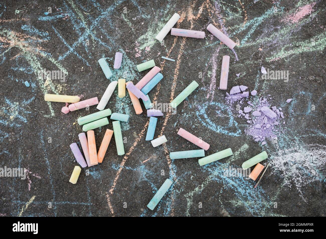 Multicolor sidewalk chalk on pavement Stock Photo - Alamy