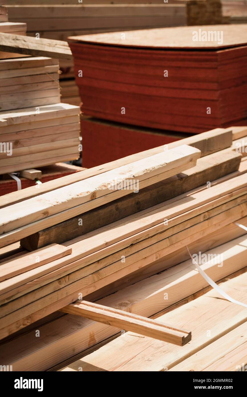 Stacks of wood planks and plywood at lumberyard Stock Photo - Alamy