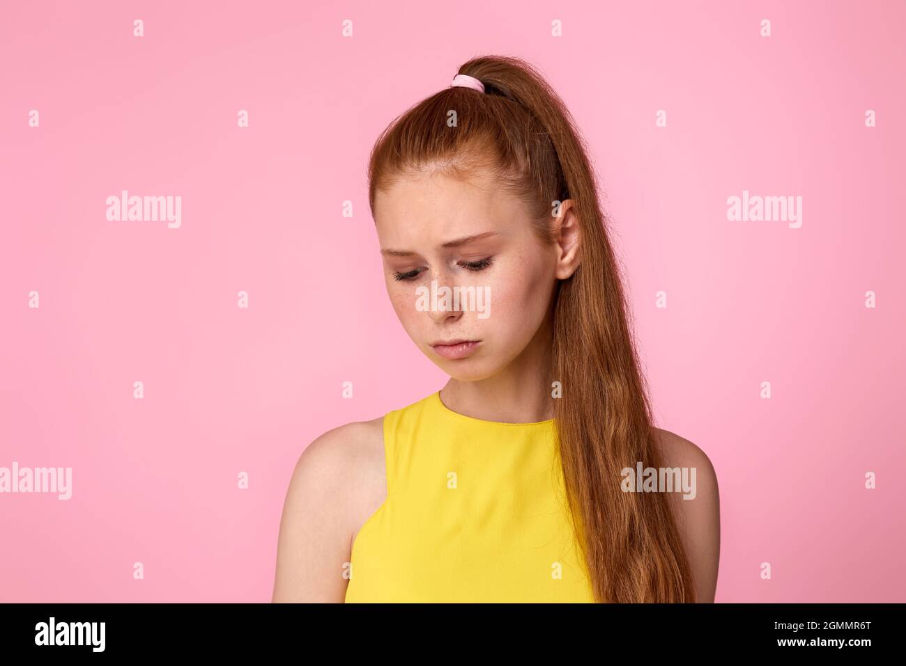 sad teen girl on green background. Human emotions Stock Photo - Alamy