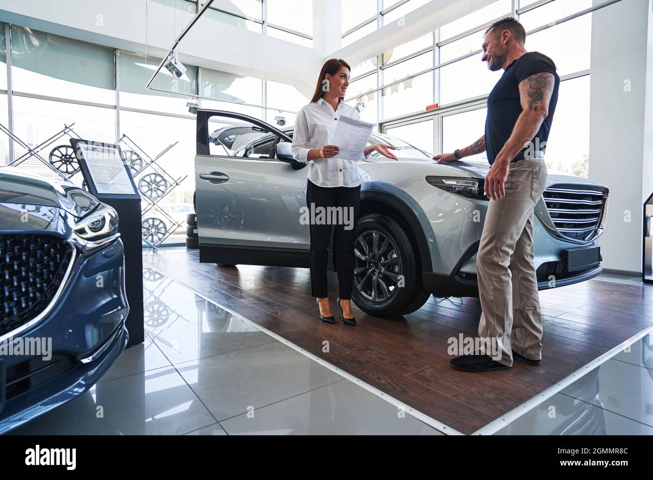 Professional custom service representative talking to her client Stock ...