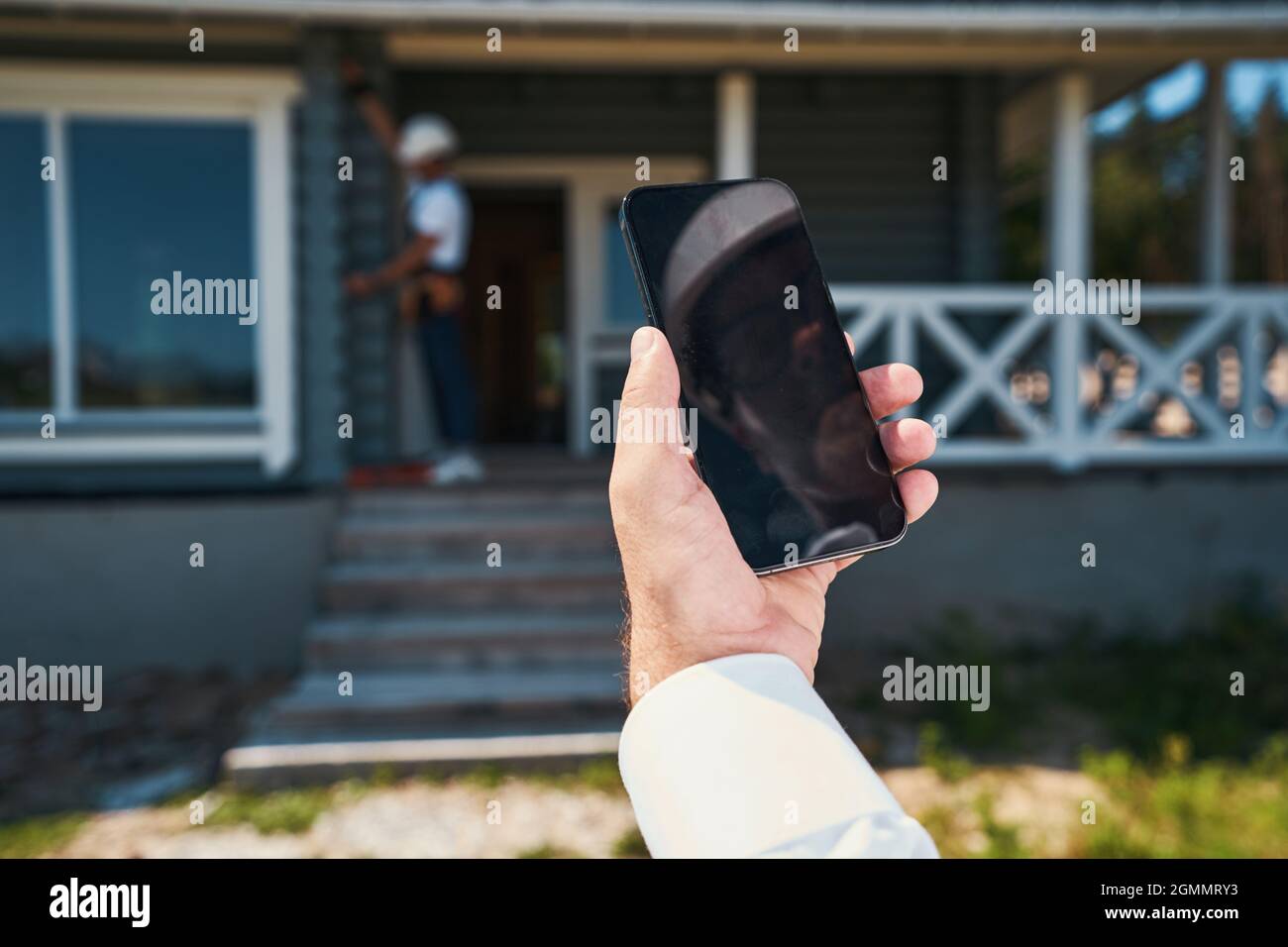Man staring at mobile phone screen in his hand Stock Photo - Alamy