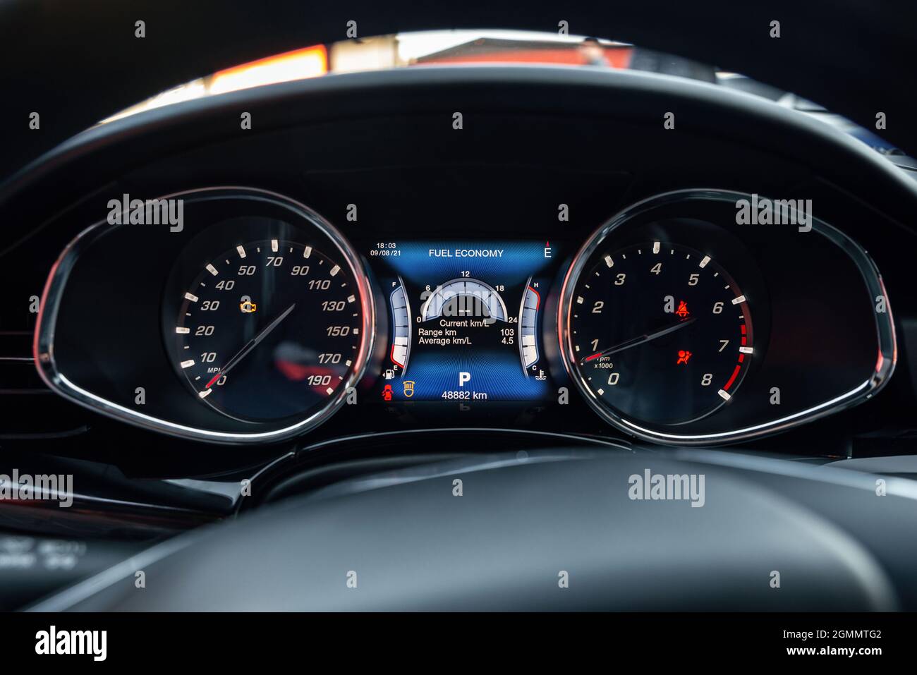Night time dashboard of modern car. Screen display of car status ...