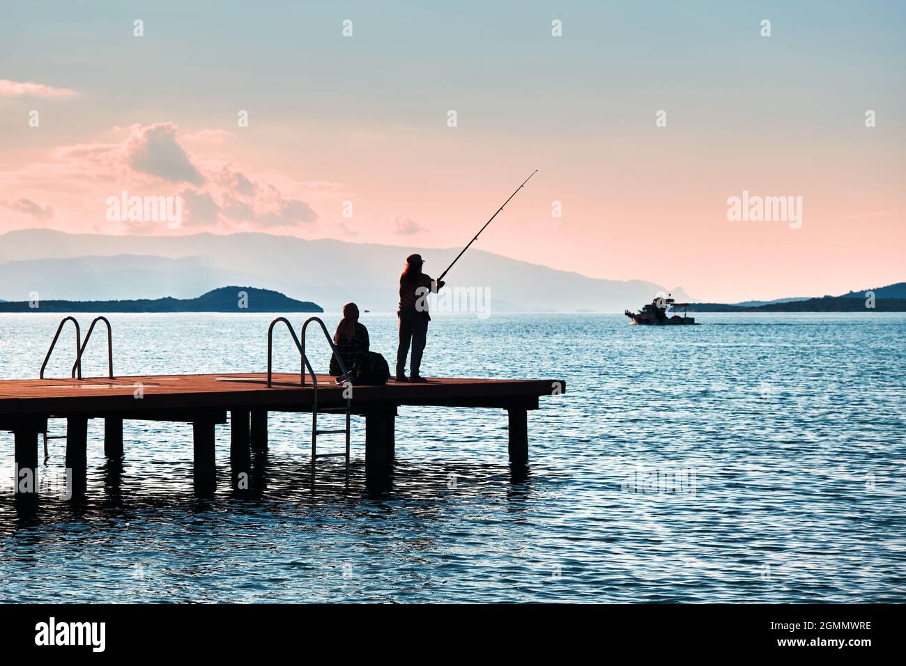Silhouette woman catching fish hi-res stock photography and images - Alamy