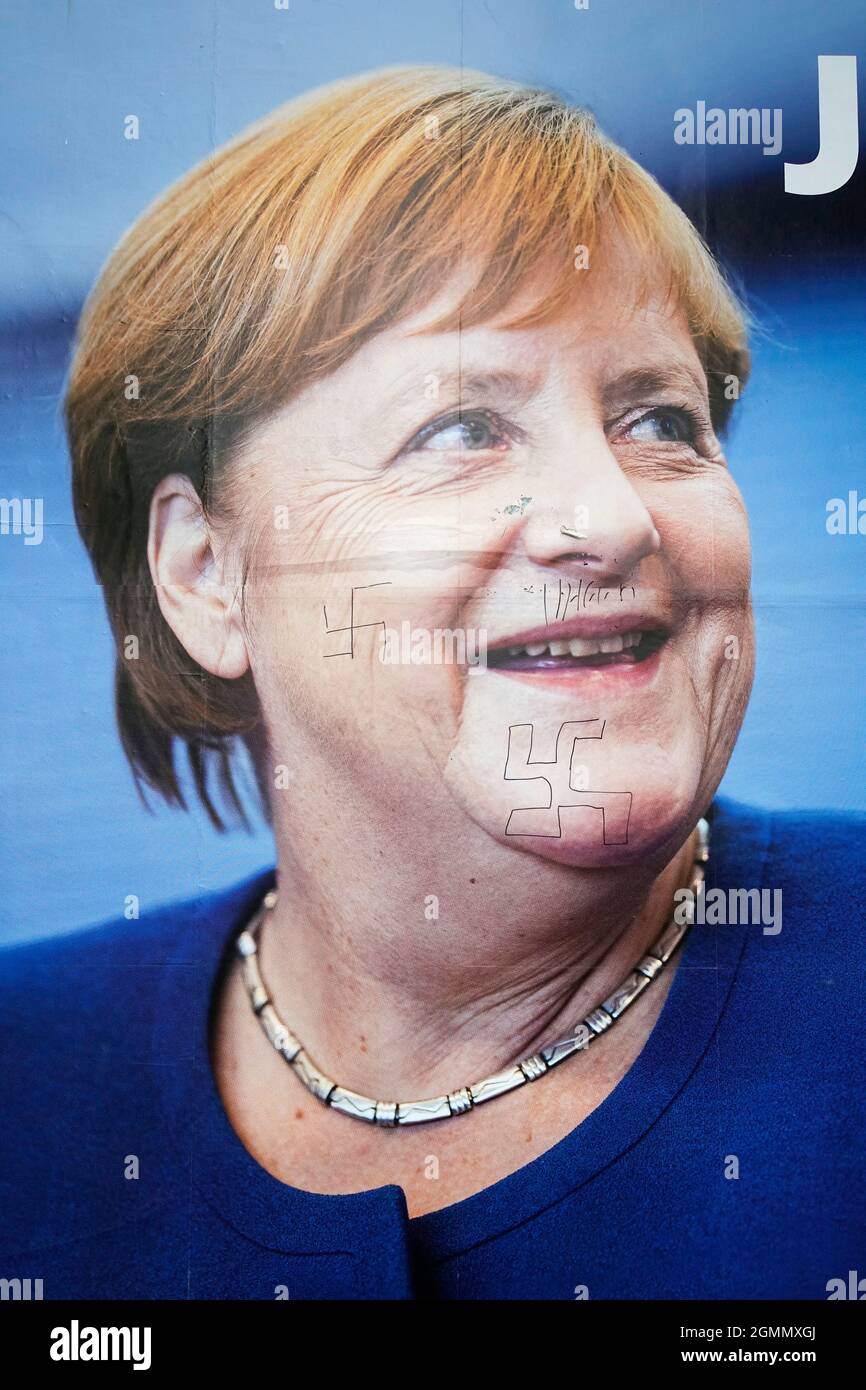 Poster, Angela Merkel, defaced with swastikas, Berlin Stock Photo - Alamy